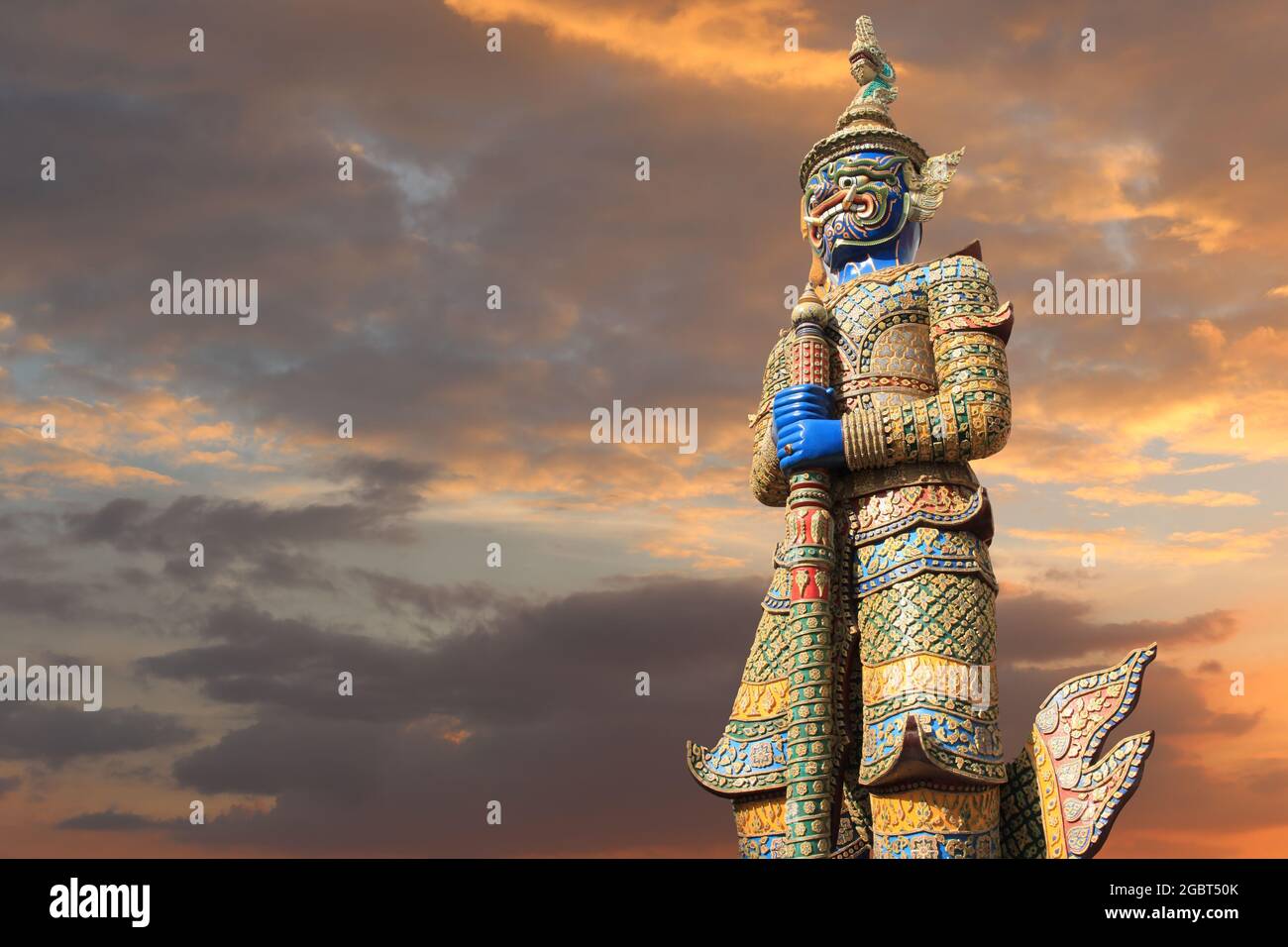 Giant statues in Thai literature on twilight evening sky background and ...