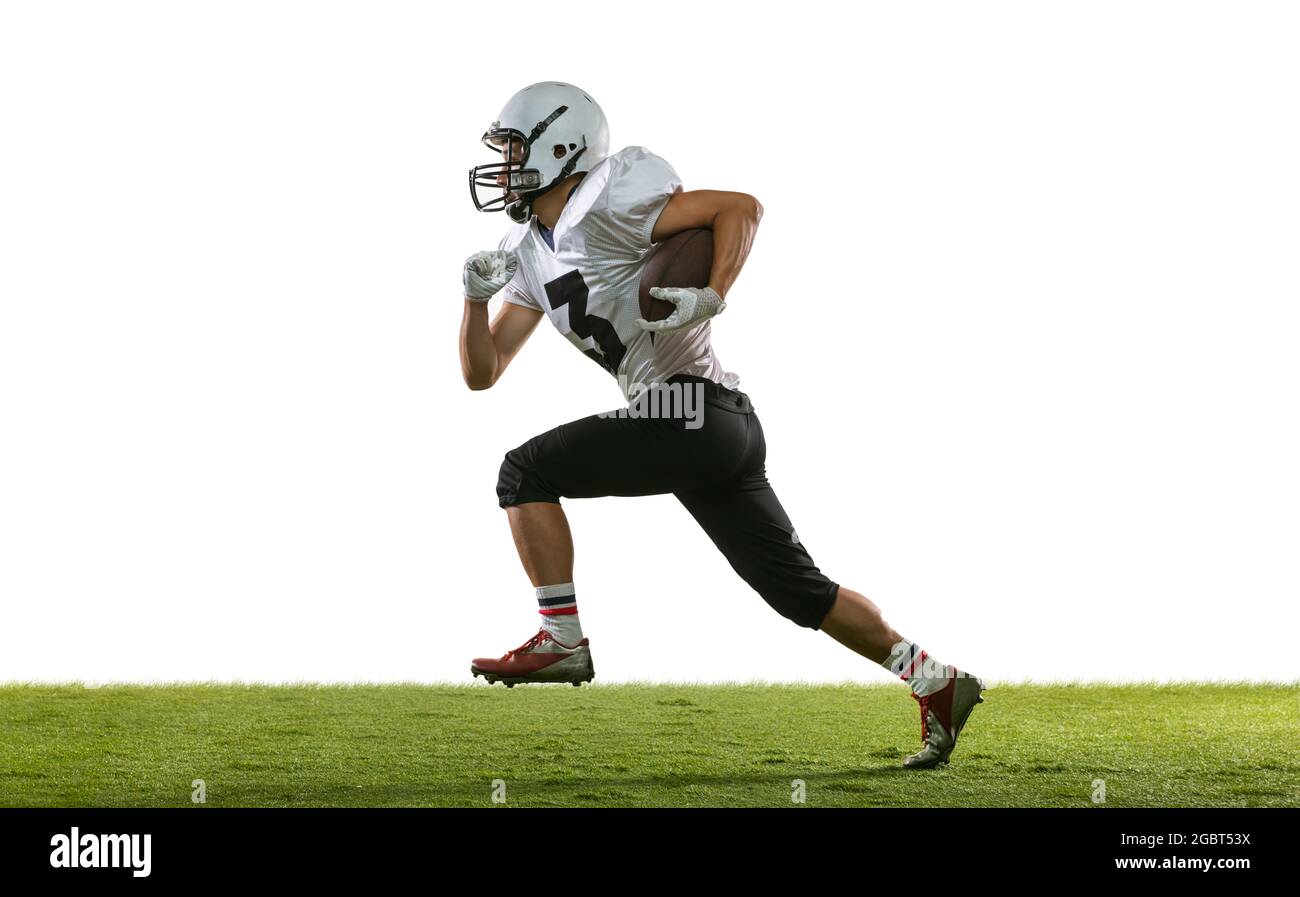 Portrait of American football player training isolated on white studio ...