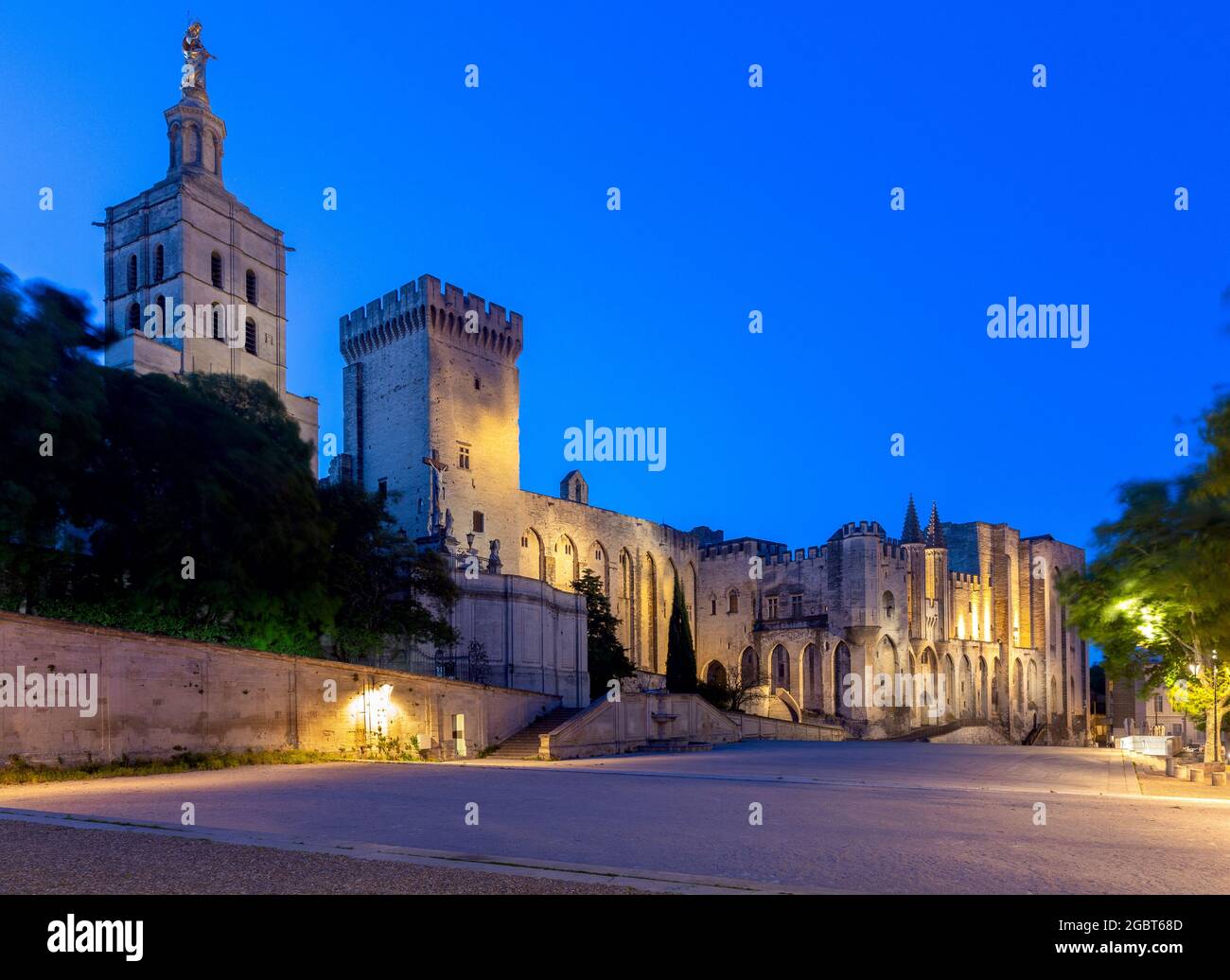 The building of the famous medieval papal palace at dawn. Avignon ...