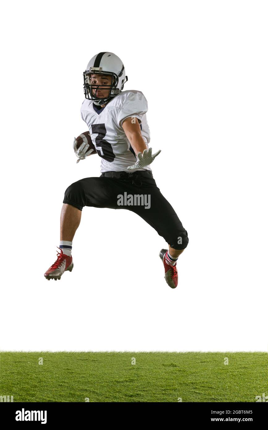 Portrait of American football player training isolated on white studio ...