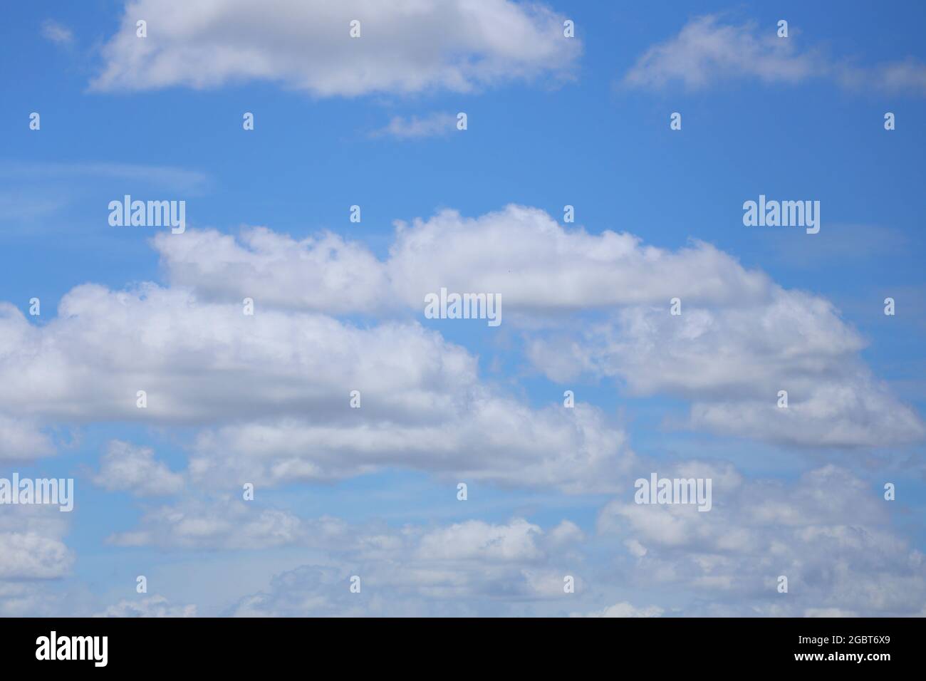 Blue sky with white clouds in the daytime background for design in you work idea concept Stock ...