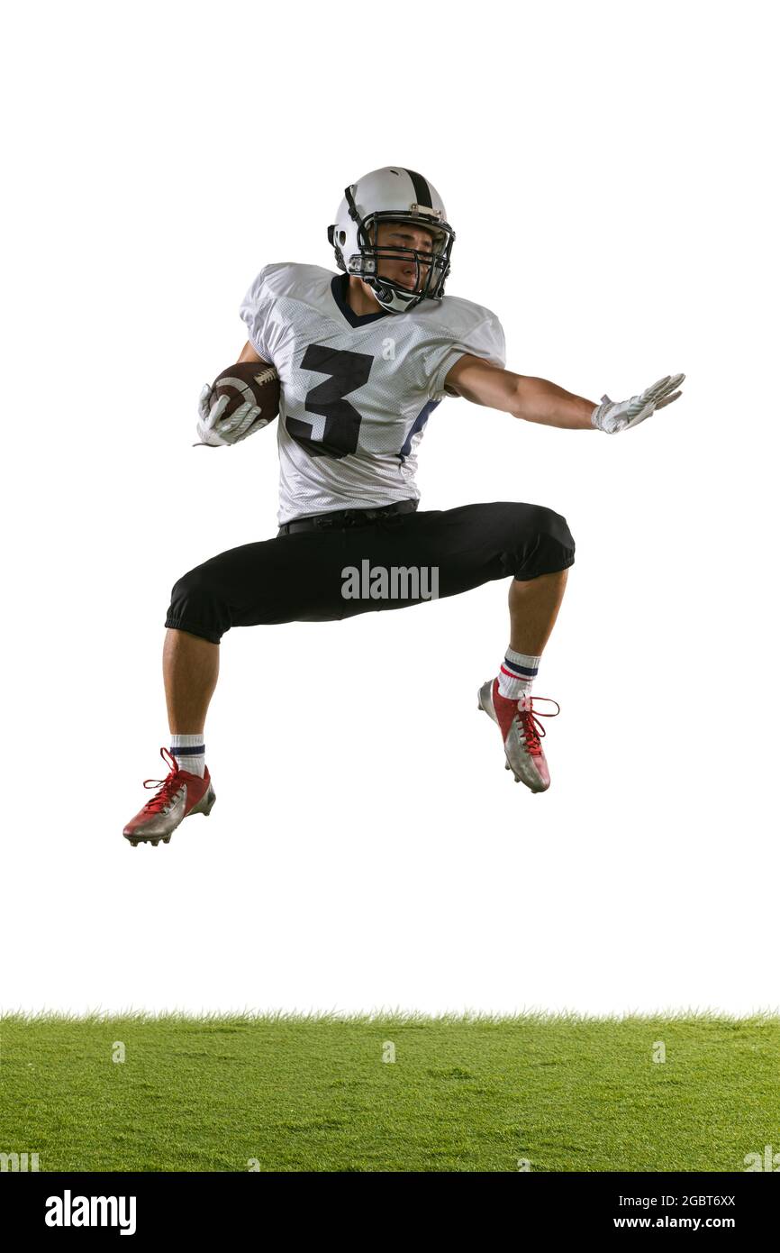 Portrait of American football player training isolated on white studio ...