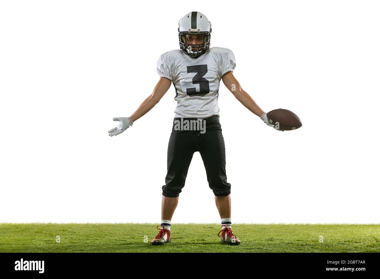 Portrait of American football player training isolated on white studio ...