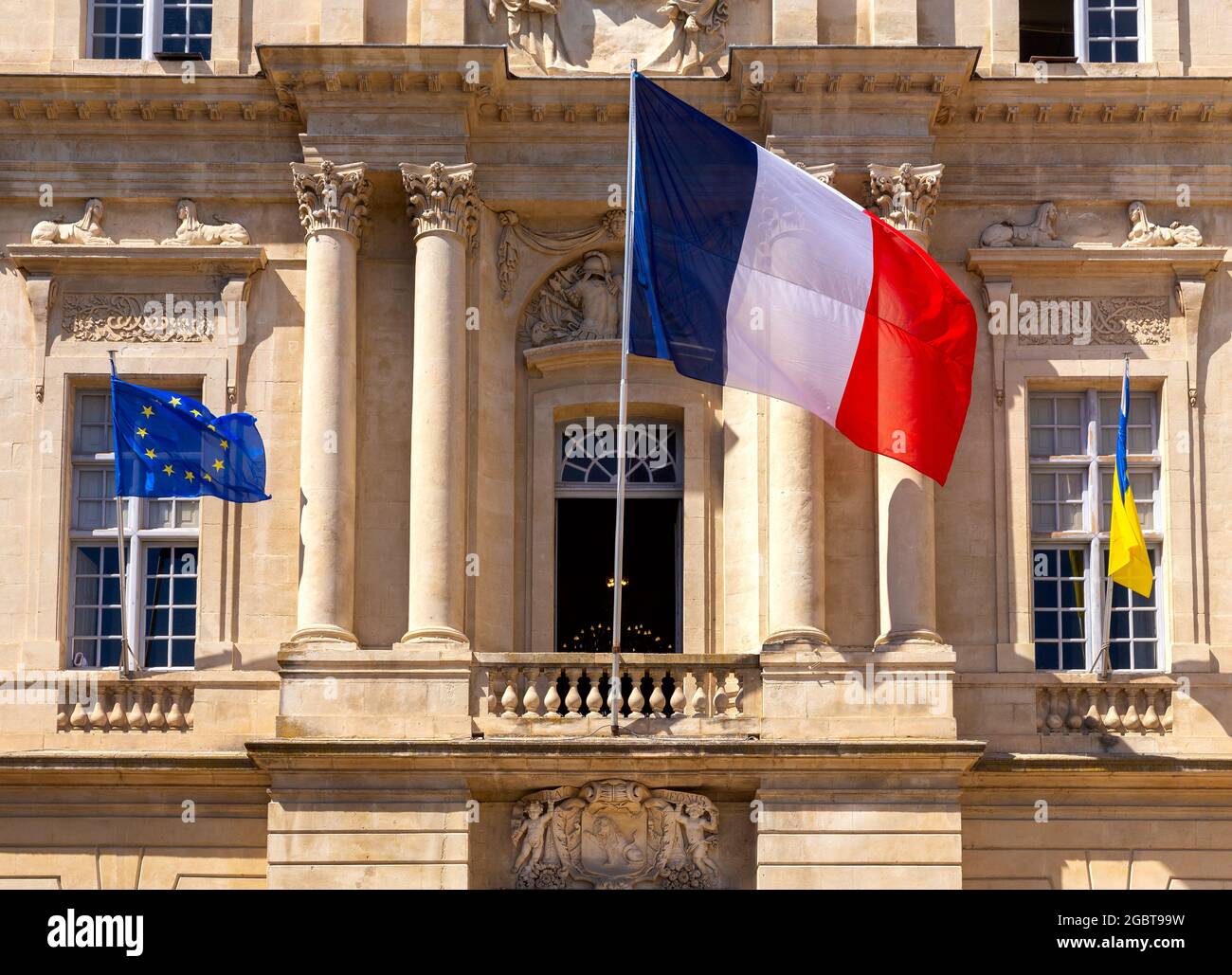 French state flag on the facade of the city hall. Arles. France ...
