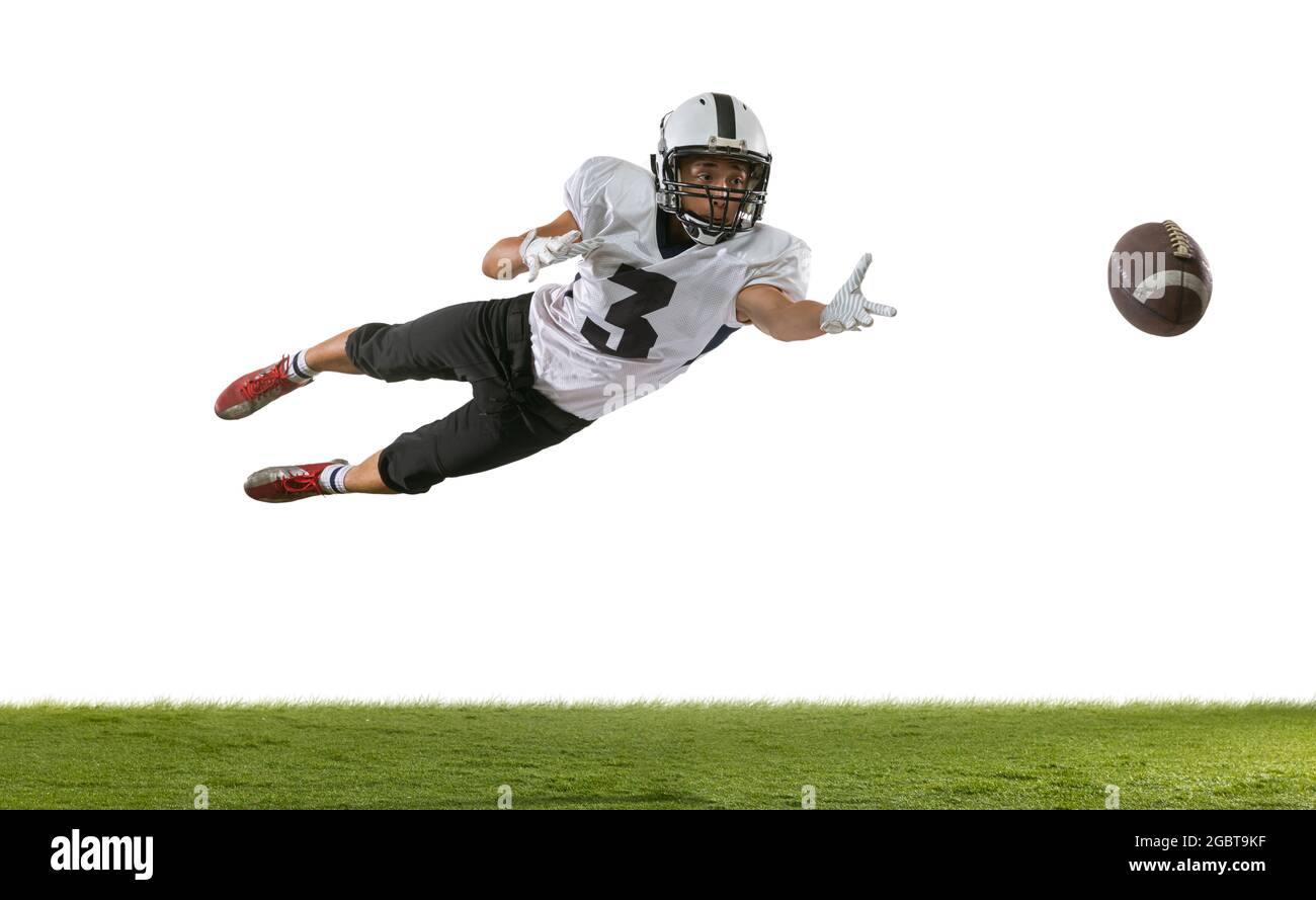 Portrait of American football player training isolated on white studio ...