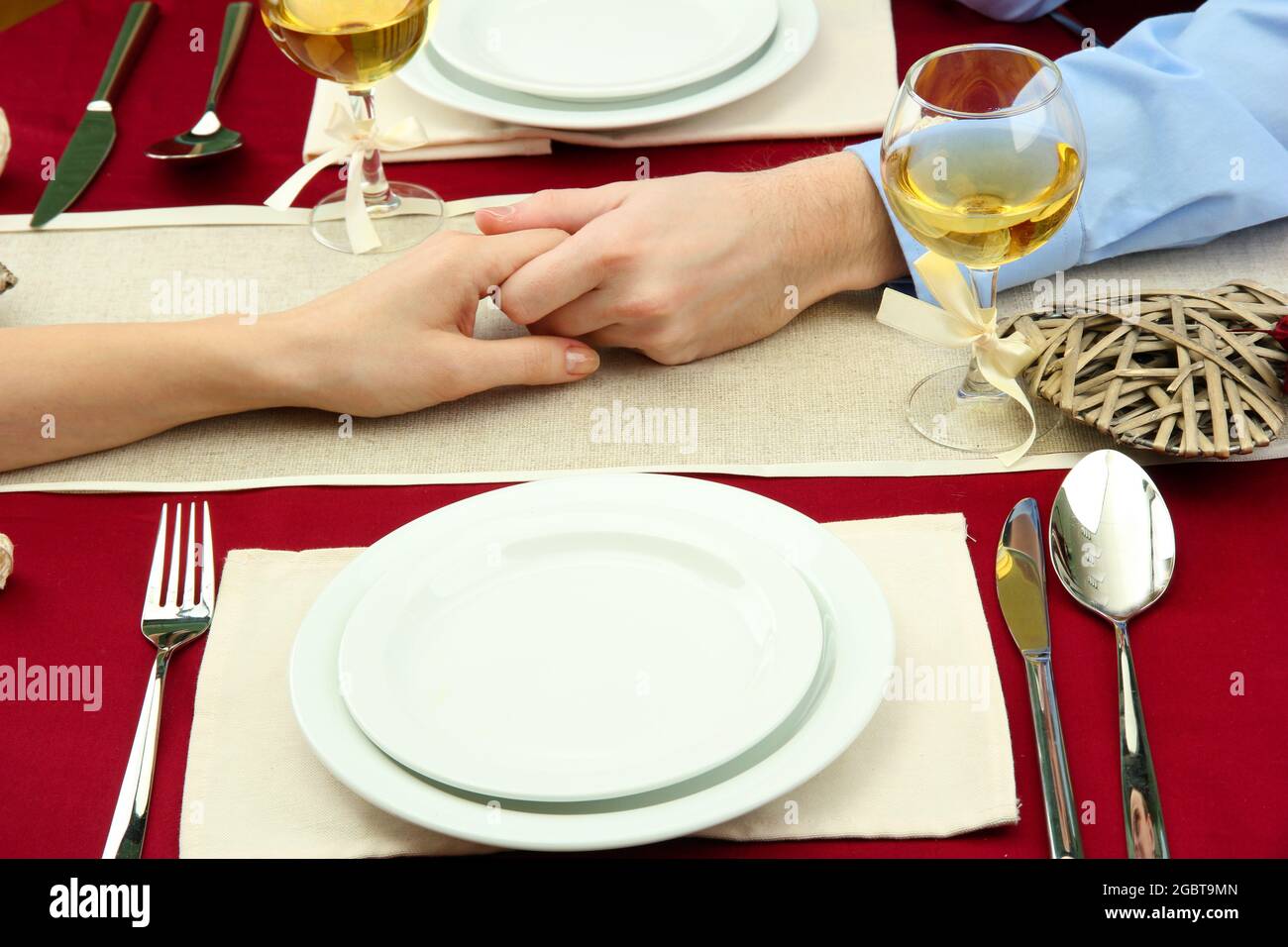 hands of romantic couple over a restaurant table Stock Photo - Alamy