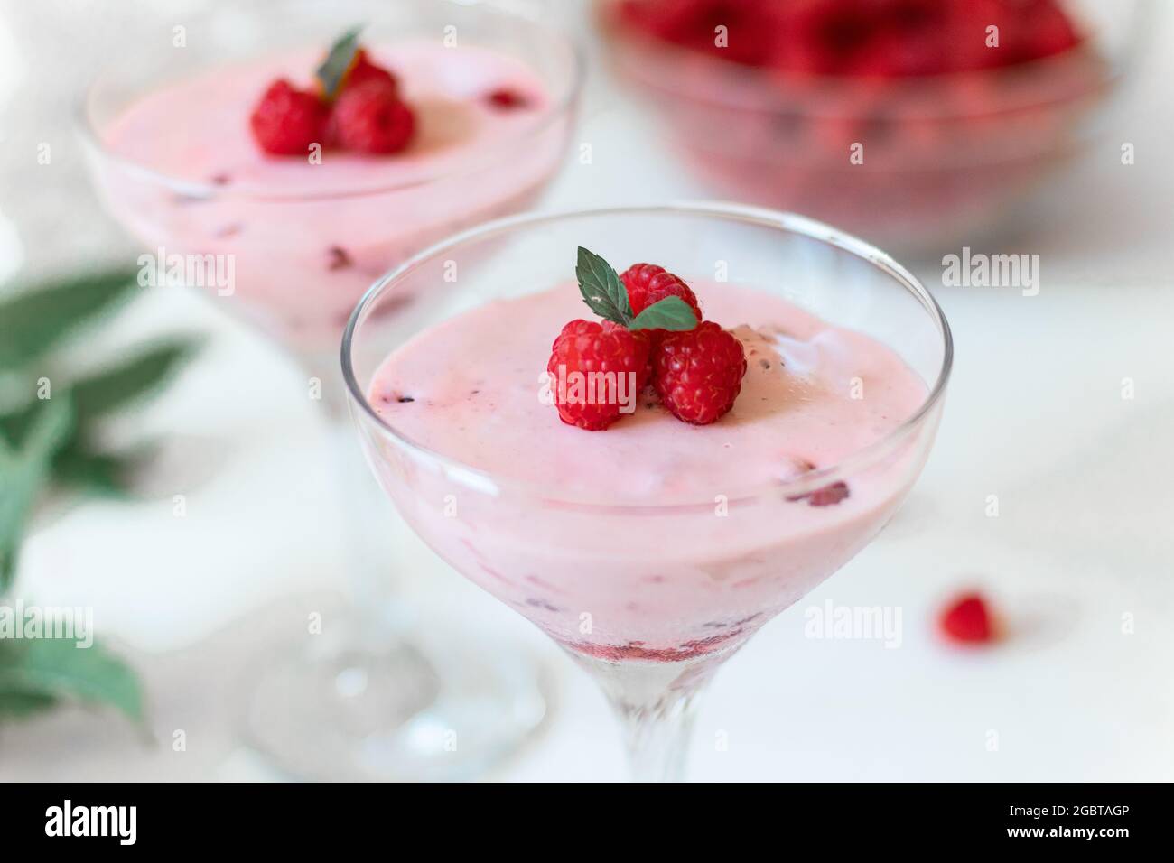 Delicious italian raspberry dessert, cheesecake, mouse in a glass on a ...