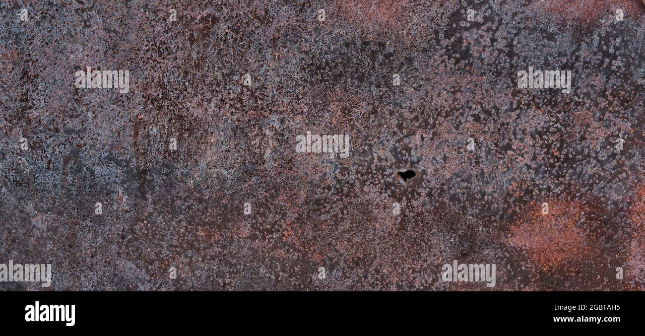 Rusty iron sheet with little hole Stock Photo - Alamy