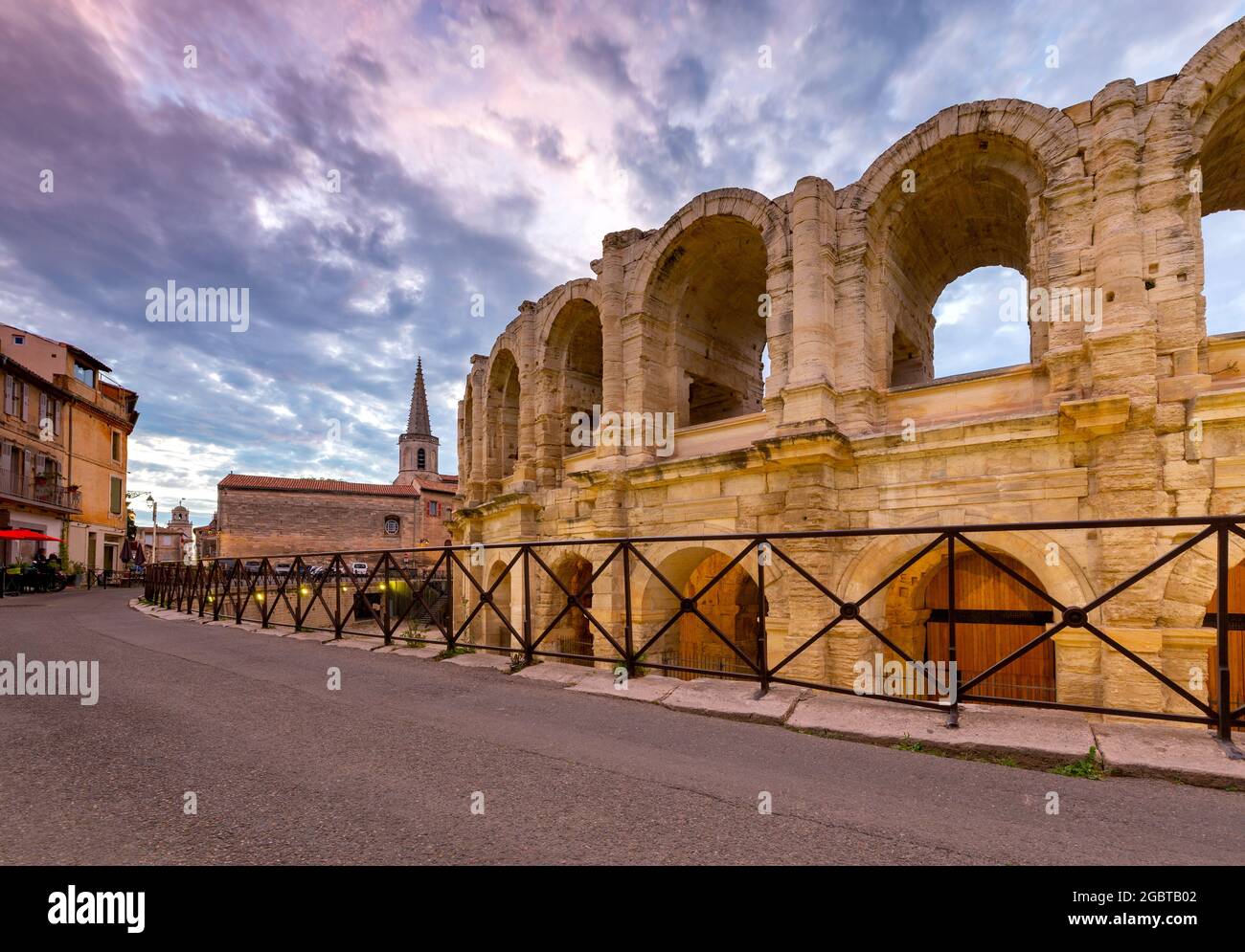 View of the old antique arena of the Roman amphitheater in the sunset. Provence. France. Arles ...