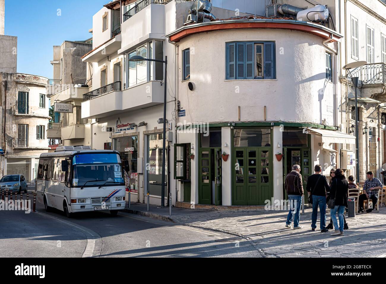 LIMASSOL, CYPRUS - February 17, 2021: Bus on a narrow street of ...