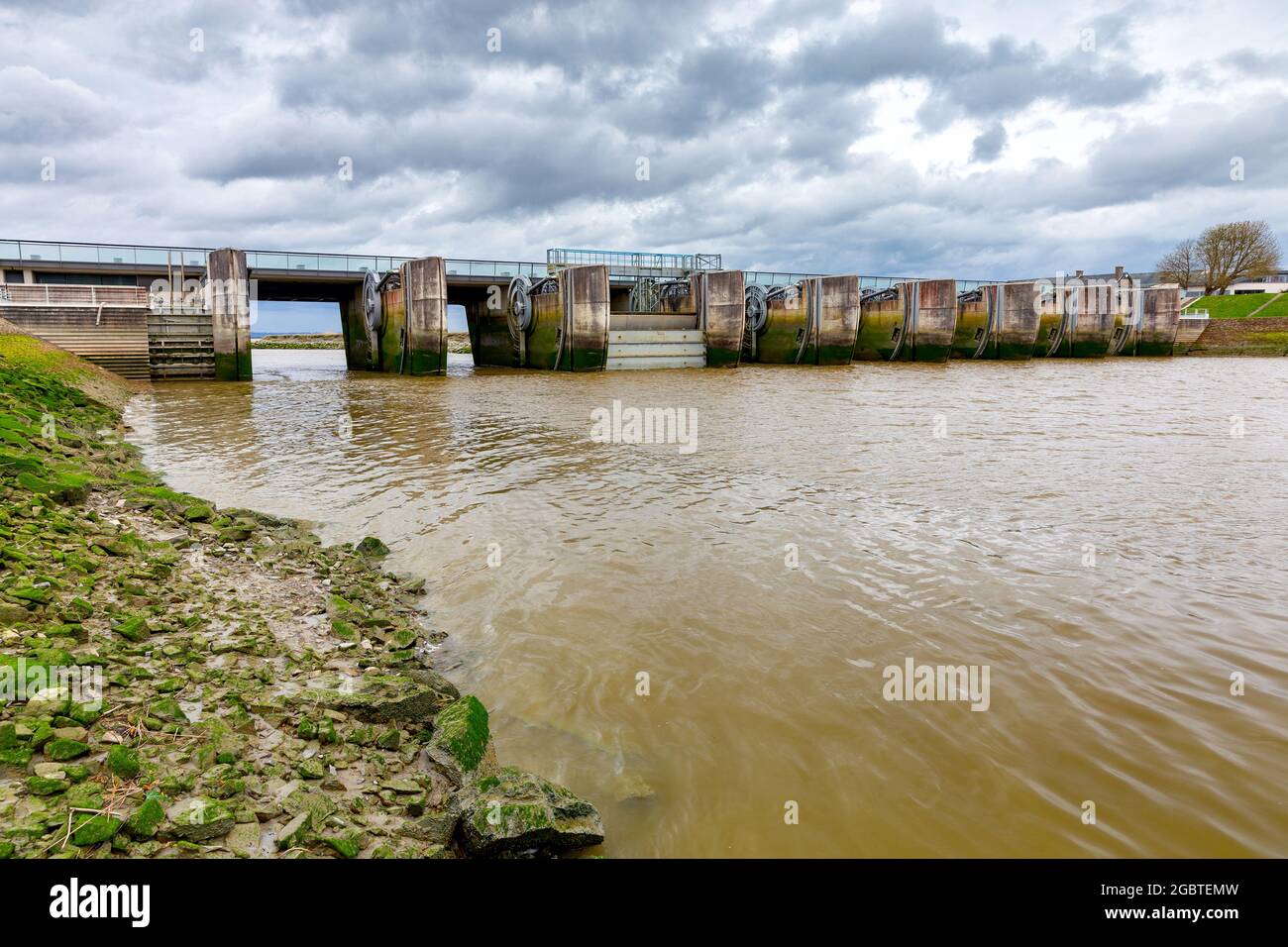 View of the dike dam on the river Kuenon with open sluices. Mont Saint ...