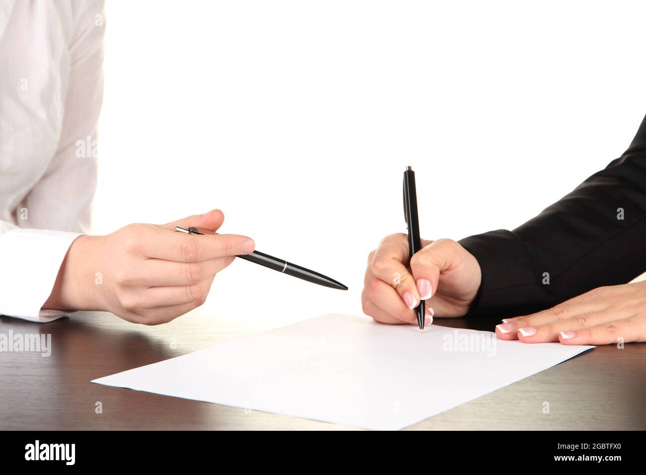 Two business partners signing document, isolated on white Stock Photo ...
