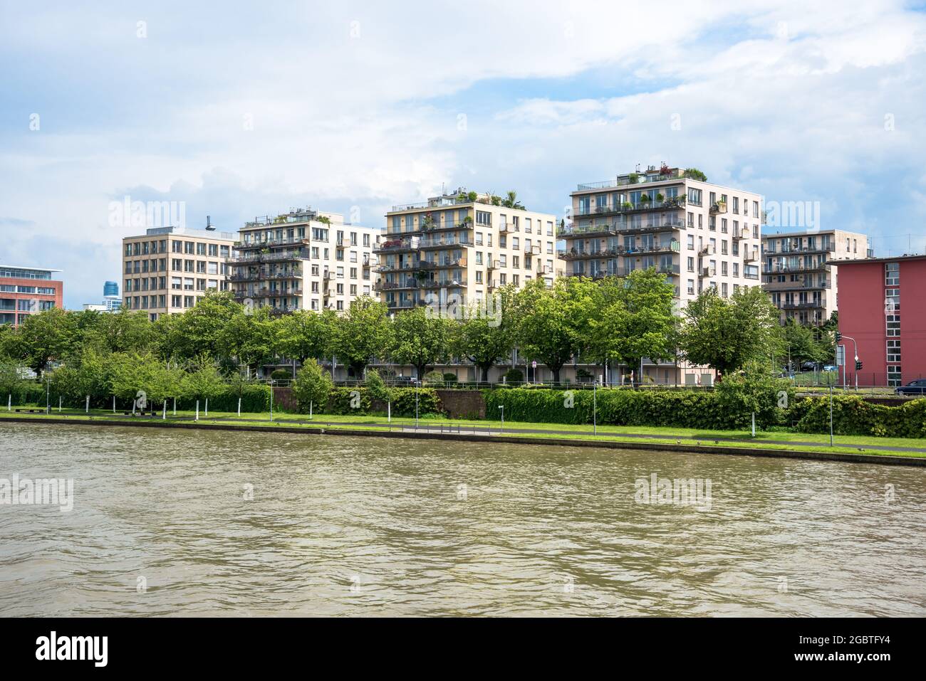 Riverside modern apartment buildings on a cloudy summer day Stock Photo ...