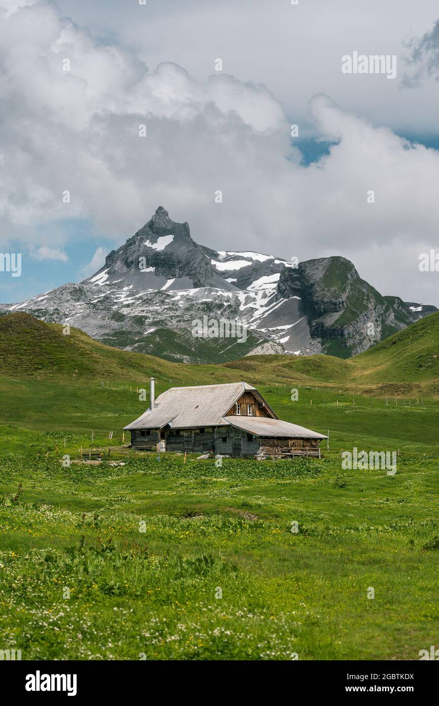 alpine hut with a peak in the swiss alps Stock Photo - Alamy