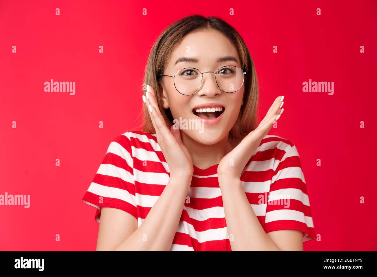 Surprised happy cheering cute asian blond girl realize got lucky ...