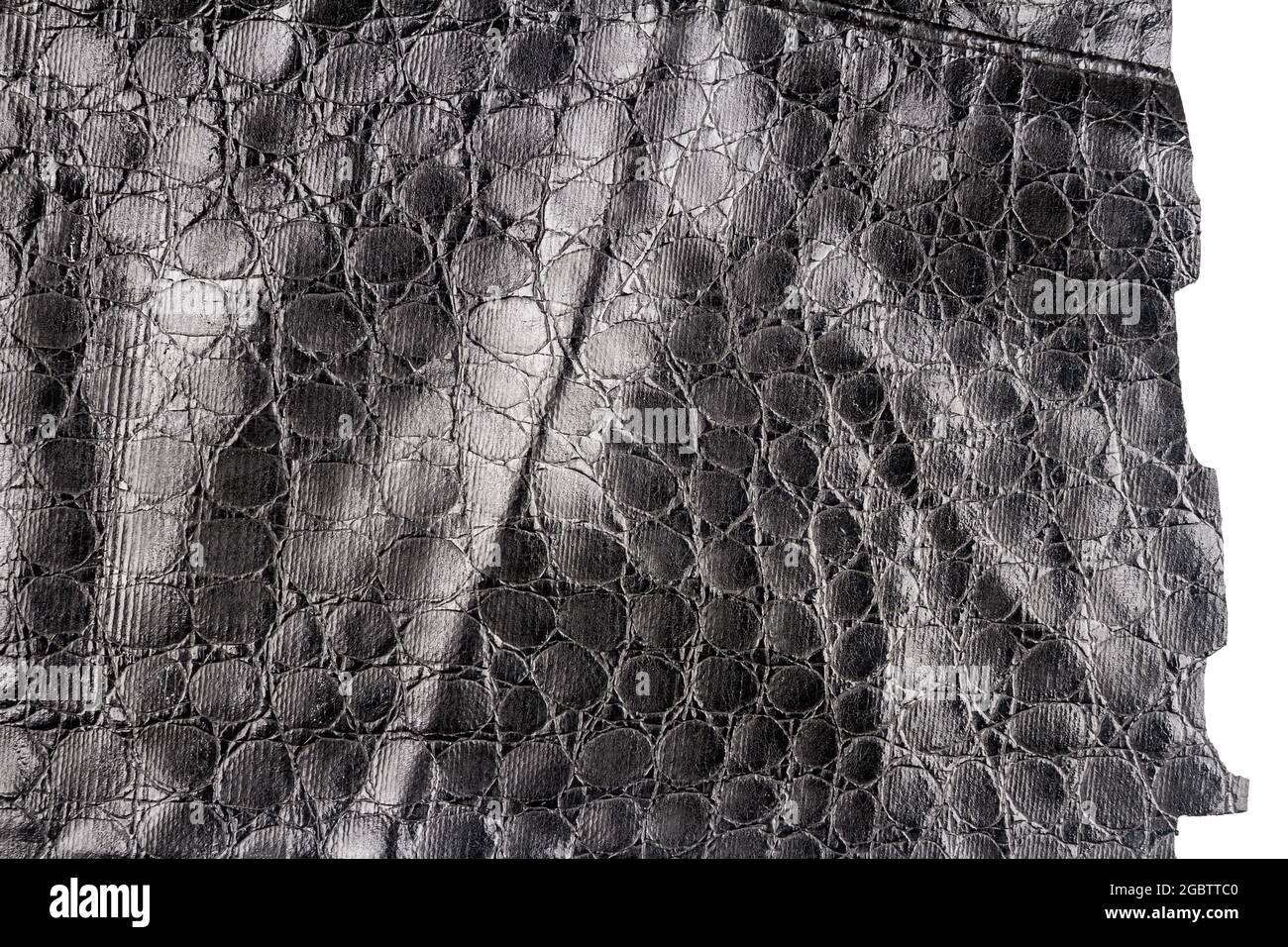 Piece of black artificial leather isolated on white background. Fake ...