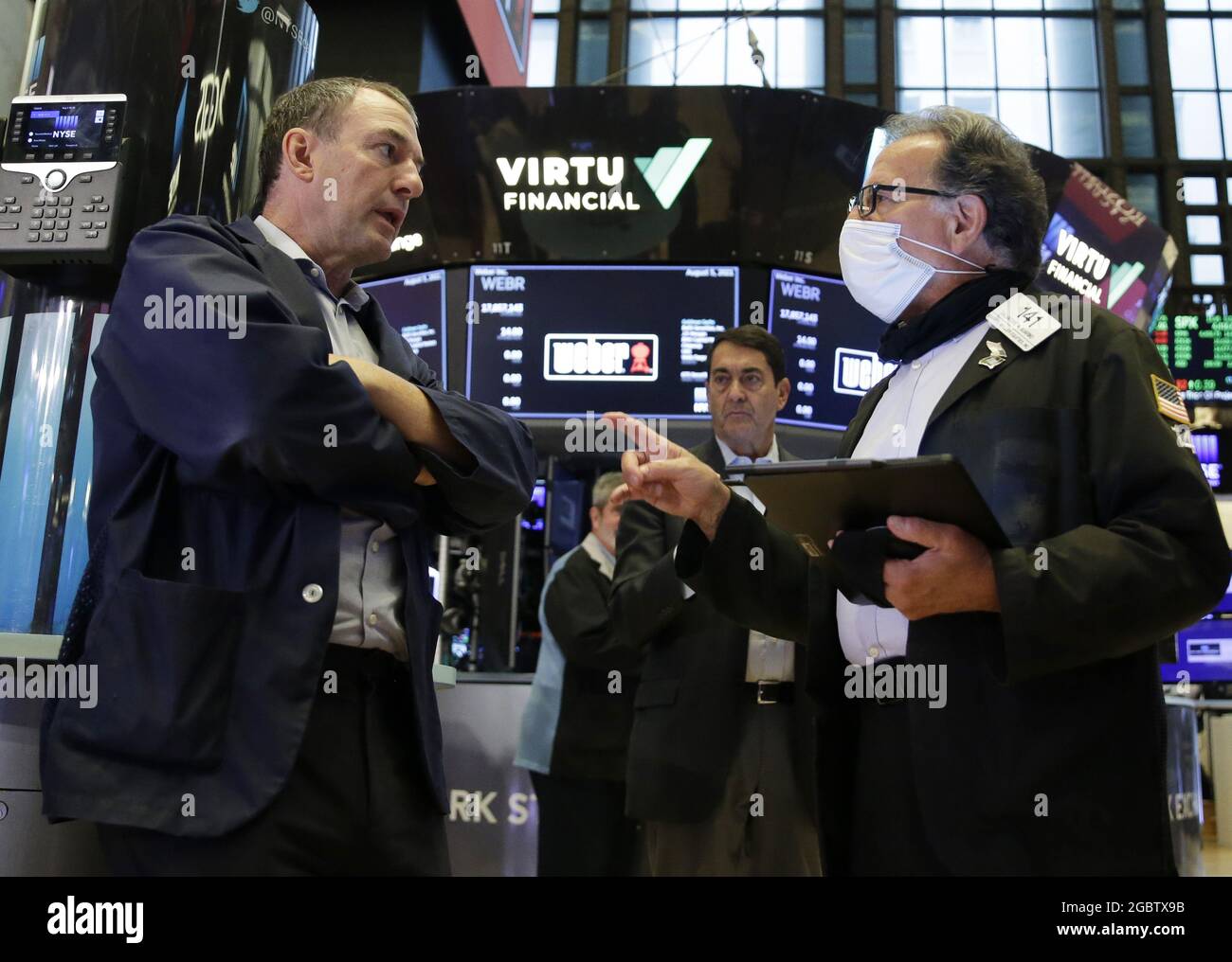 Traders work on the floor of the NYSE on the day that grill maker Weber ...