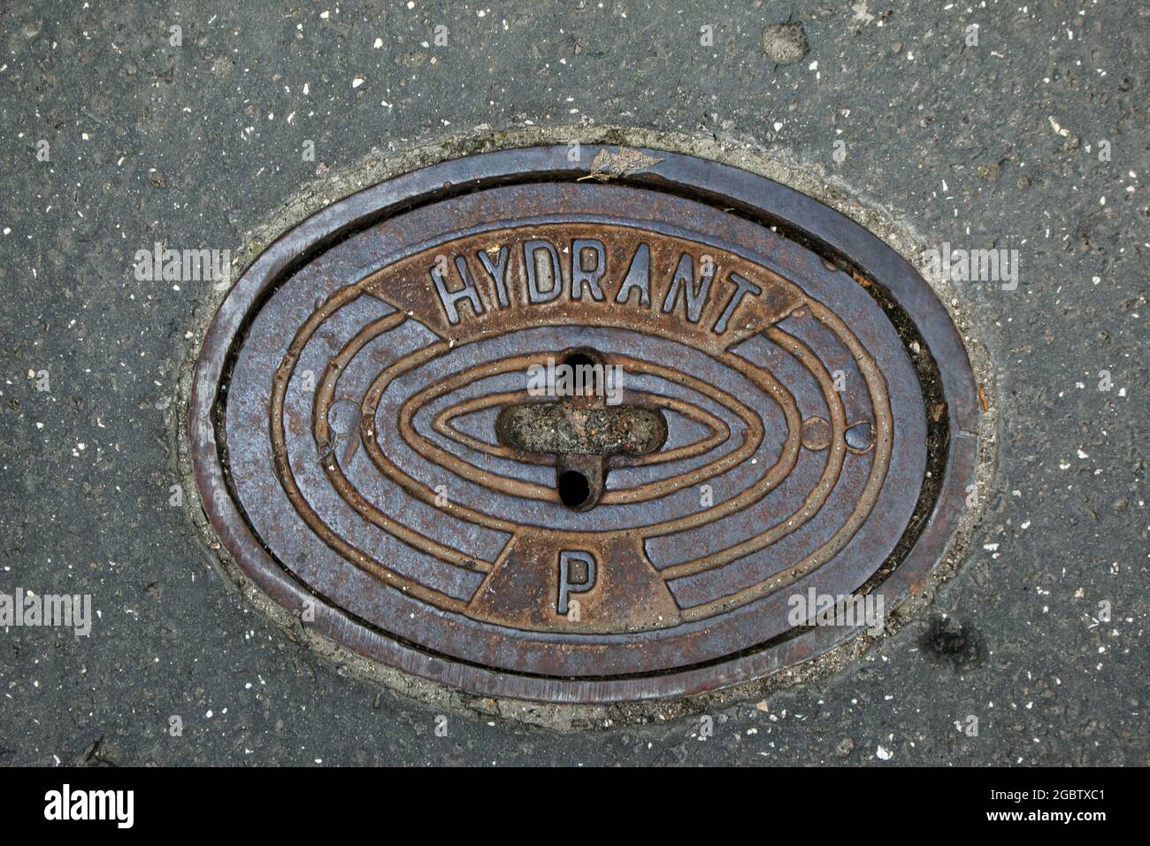 Manhole cover in road hi-res stock photography and images - Alamy