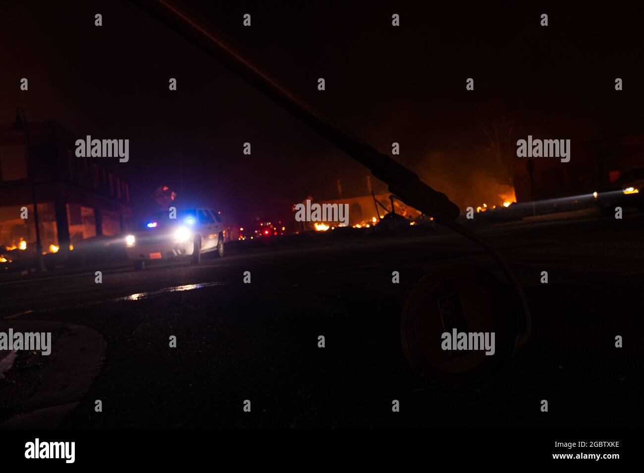 A burned lamp pole hangs in the street in downtown Greenville, CA on ...