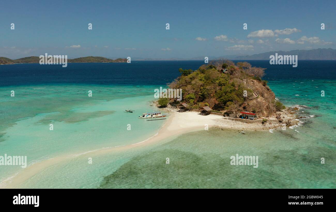 Tropical island and sand beach, turquoise water and coral reef, aerial ...