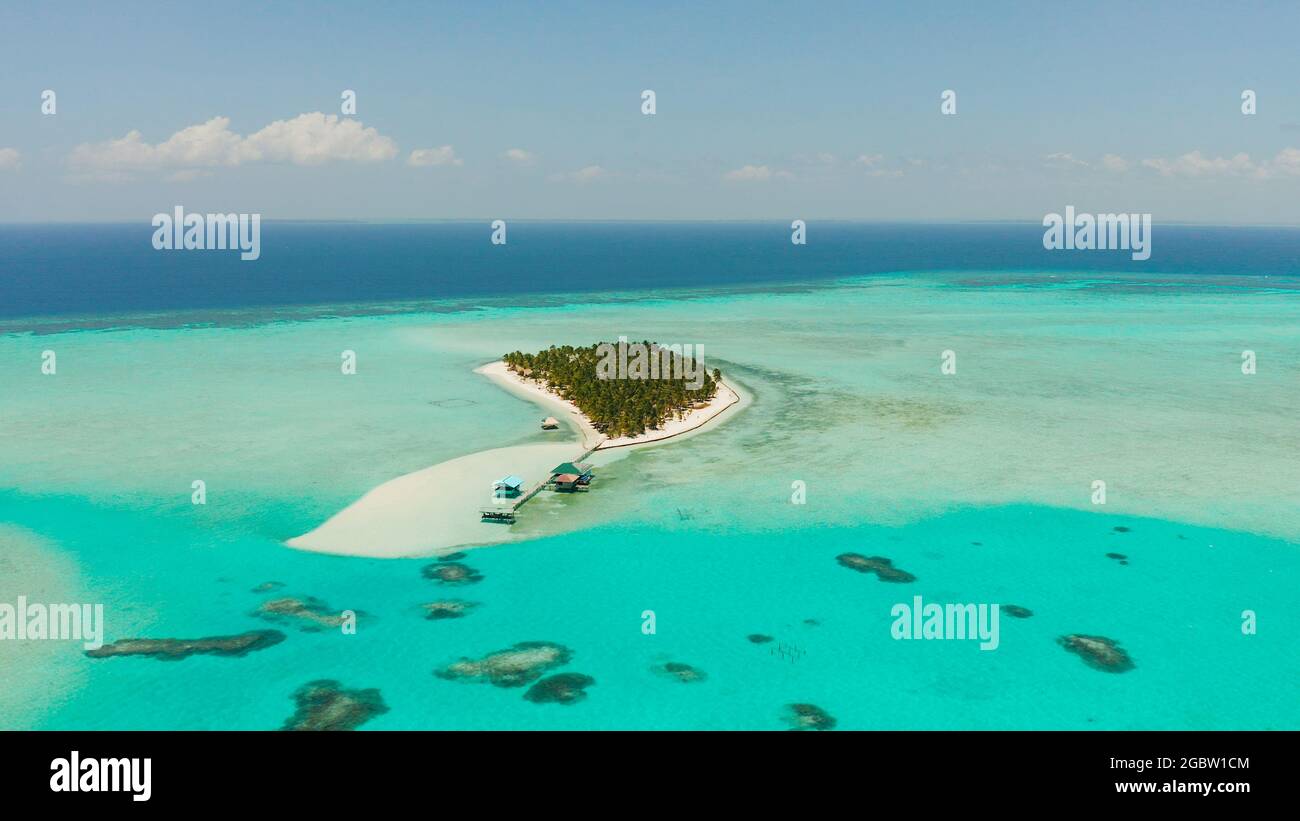 Sand beach and tropical islands by atoll with coral reef, top view ...
