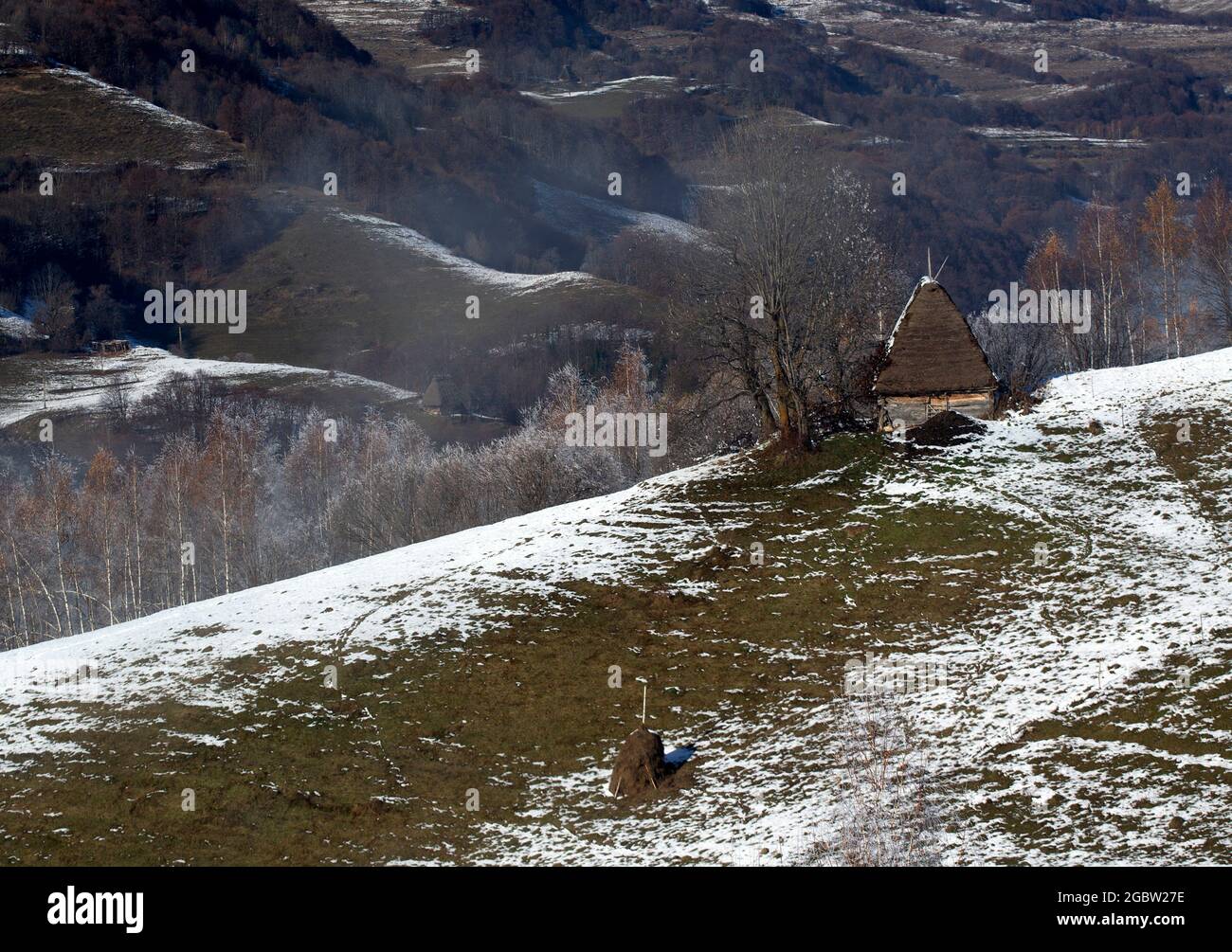 Winter landscape of pasture-land with cottage and haystack Stock Photo ...