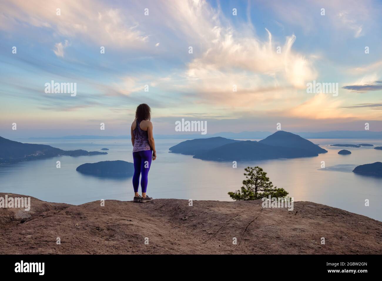 Adventurous Woman Hiking on top of Mountain Landscape Stock Photo - Alamy