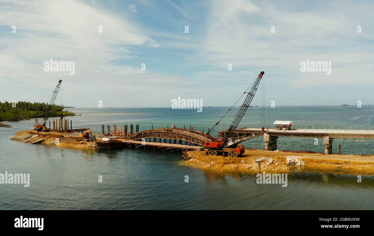 Pile hammer working on construction site. Bridge under construction ...