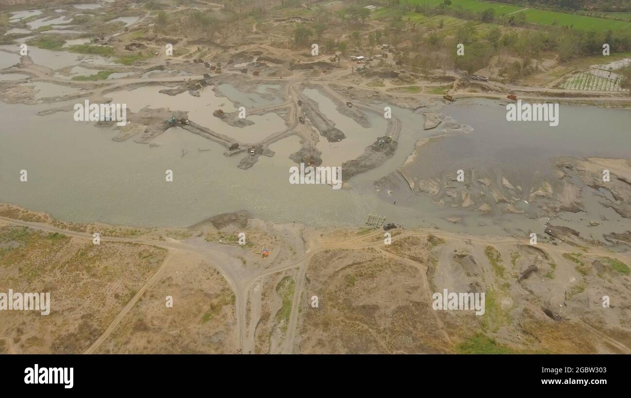 Aerial view excavator and heavy equipment, dredging and deepening the ...