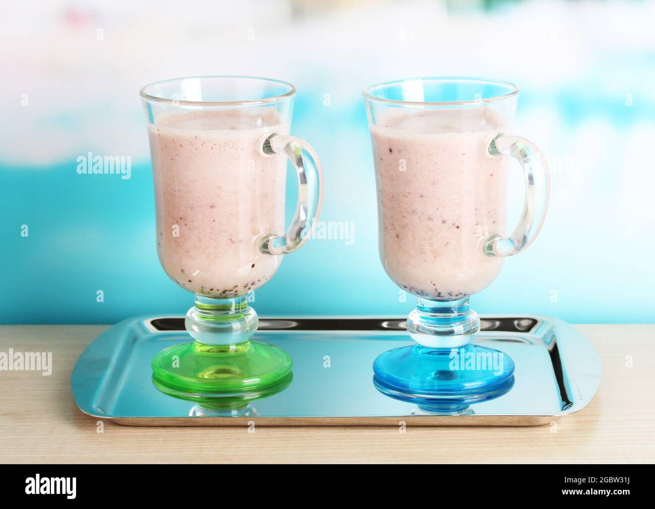 Cream cocktails on brightblue background Stock Photo - Alamy