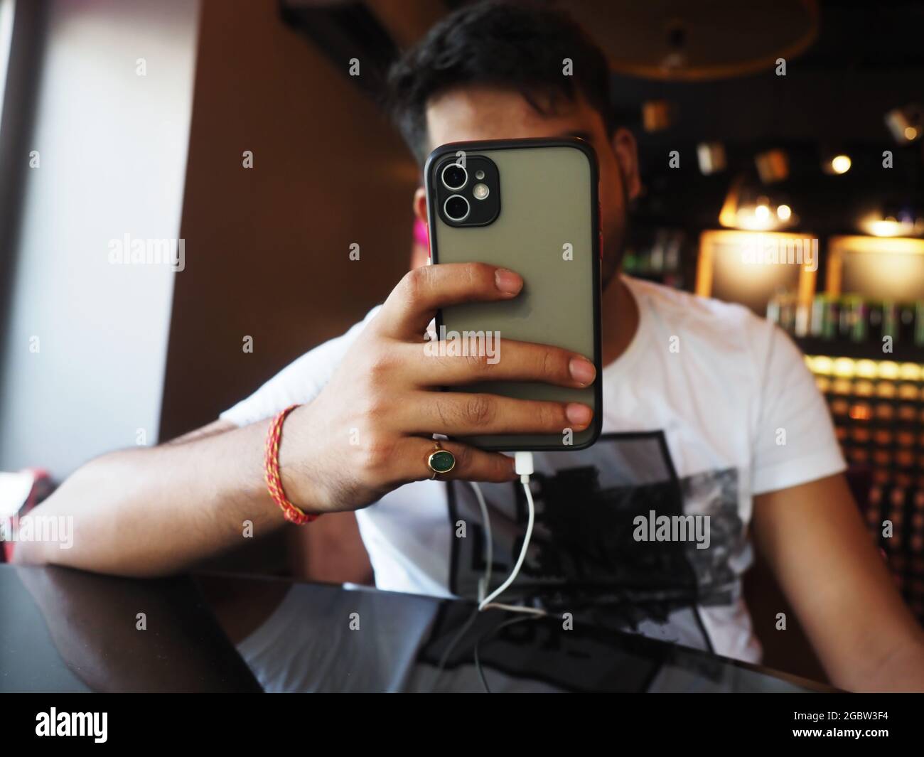 KOLKATA, INDIA - Aug 05, 2021: Man Holding iPhone isolated in ...