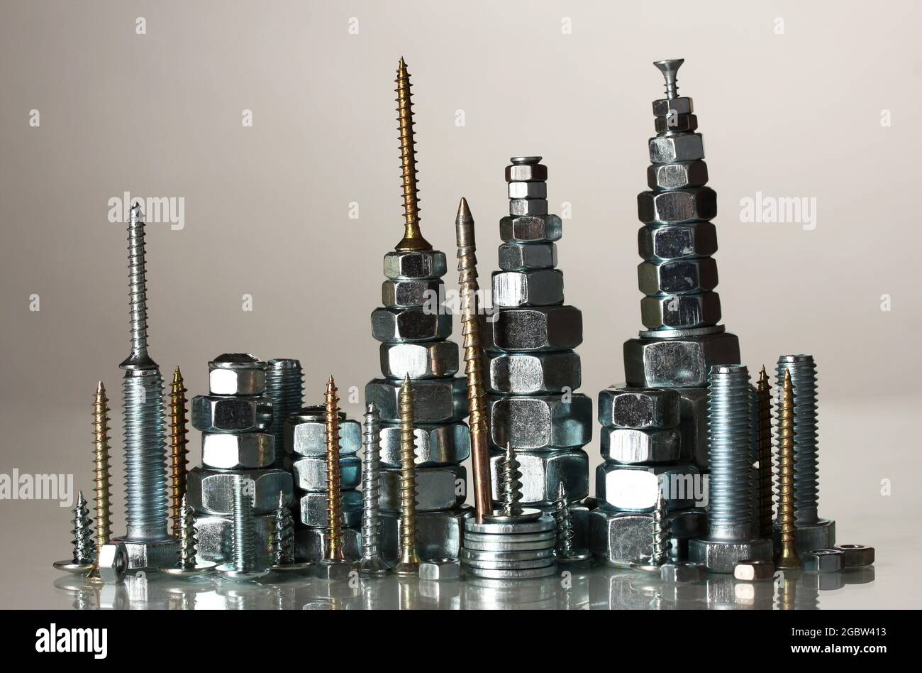 Many types of metal bolts, screws and nuts on grey background Stock ...
