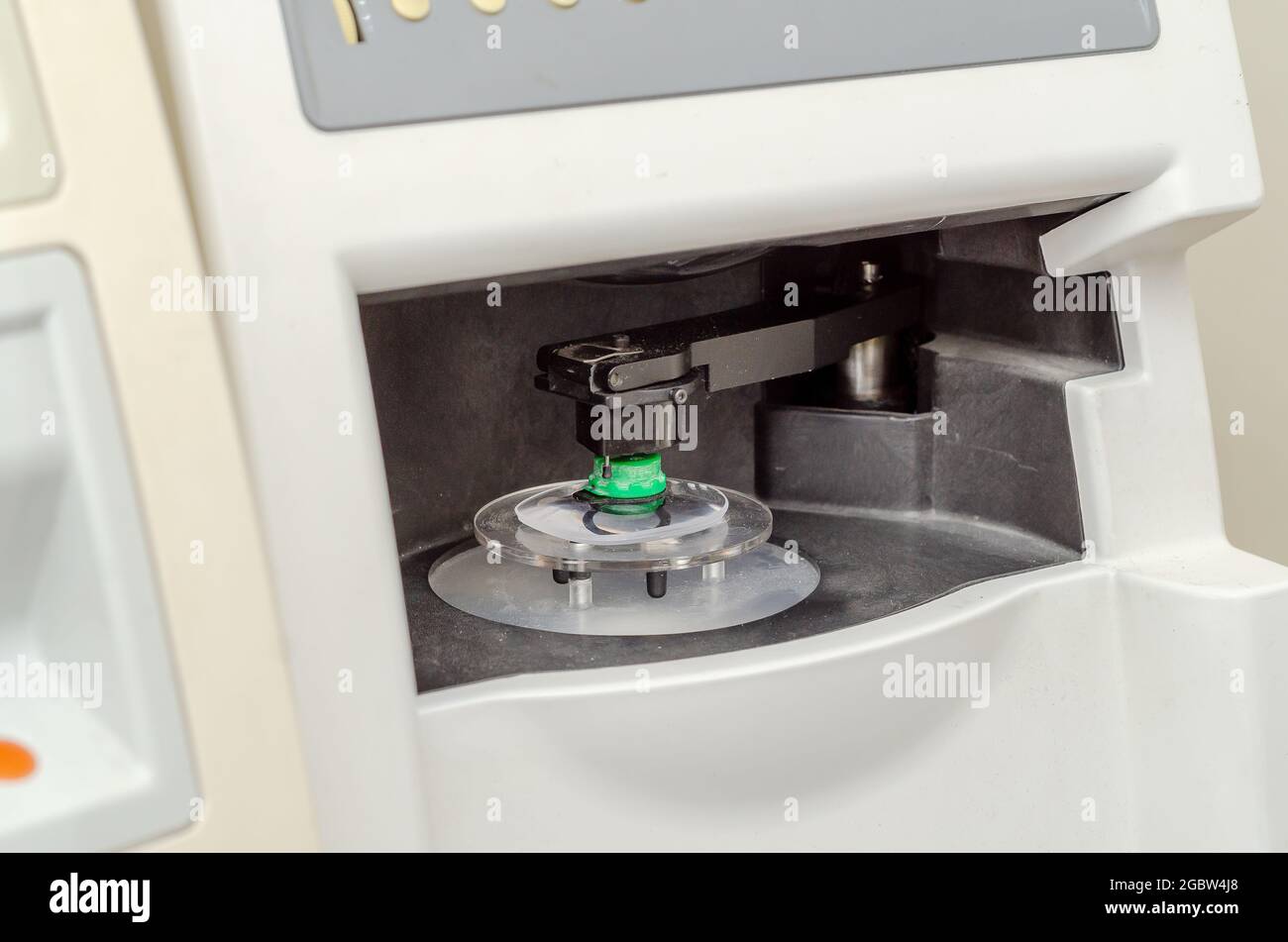 Making glasses. Lens glasses centering machine in an optics store Stock ...