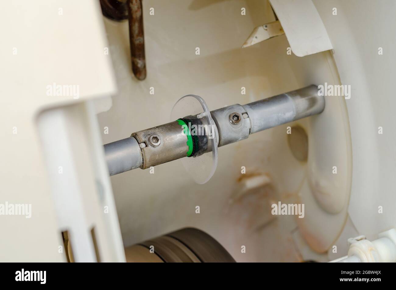Making glasses. Machine for grinding and trimming eyepiece lenses in an ...