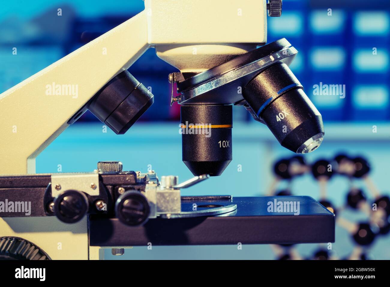 Microscope and model of chemical molecule in school class Stock Photo ...