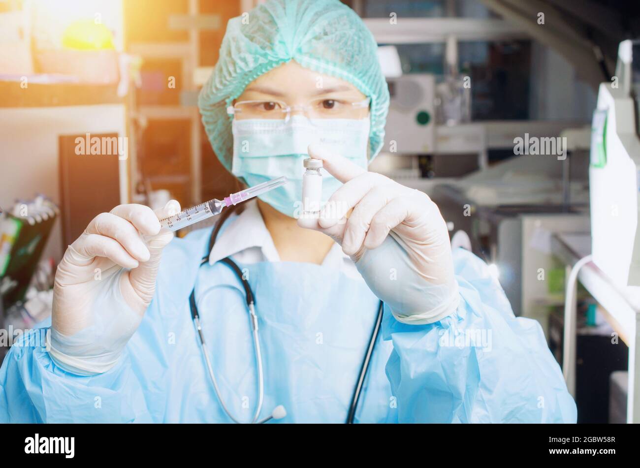 Vaccine COVID-19 . Syringe and blue vaccine vial, bottle of medicine ...