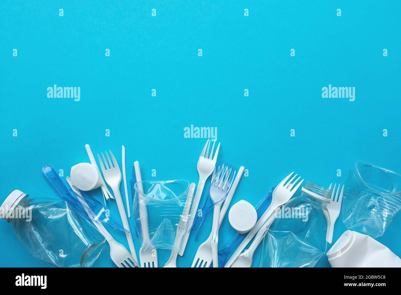 White plastic garbage on a blue background. The concept of plastic ...