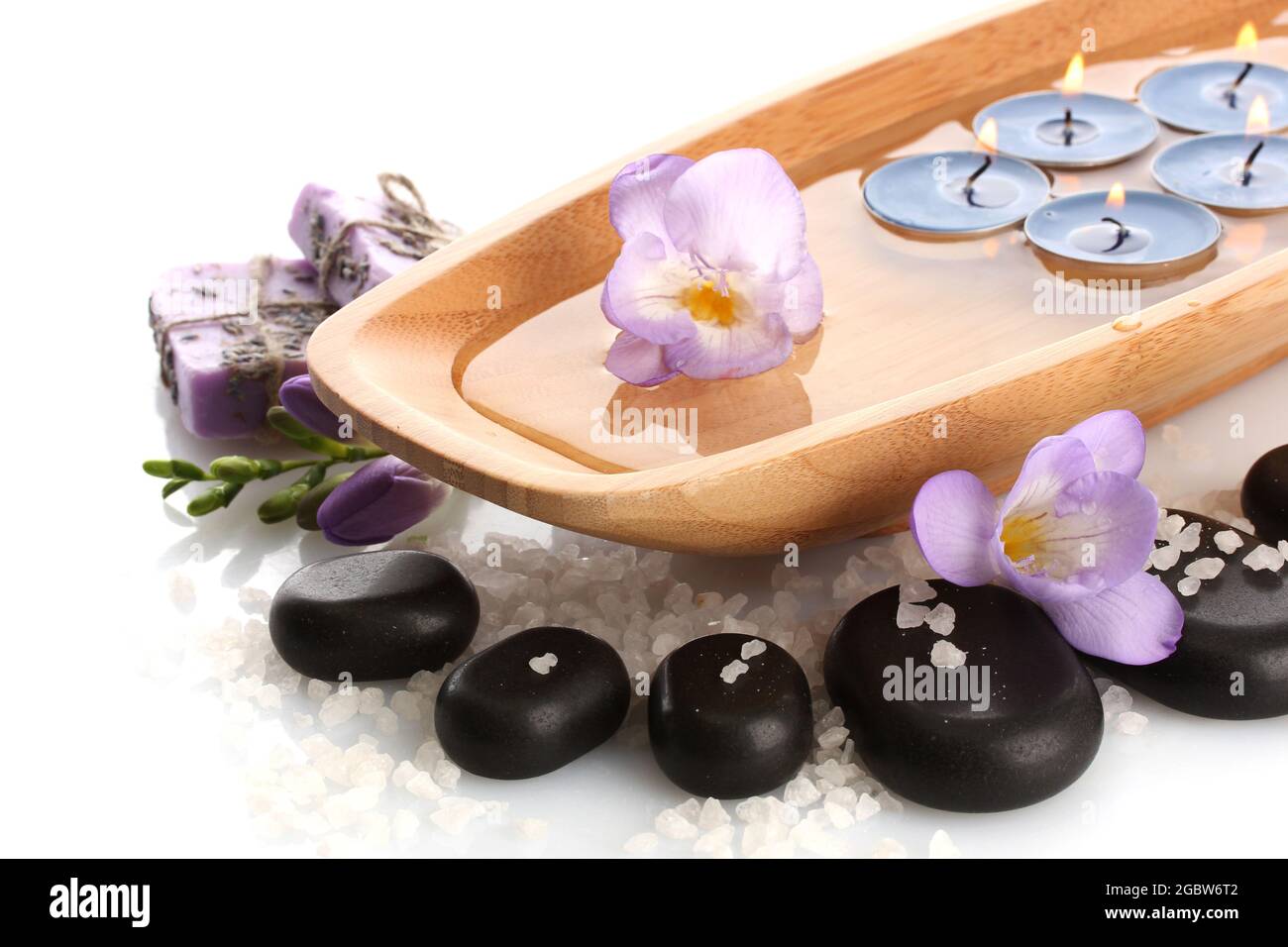 Beautiful spa setting with flowers, isolated on white Stock Photo - Alamy