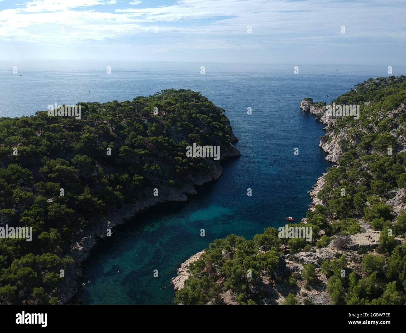 Aerial view of Calanque de Port Pin Beach with rocks and trees in ...