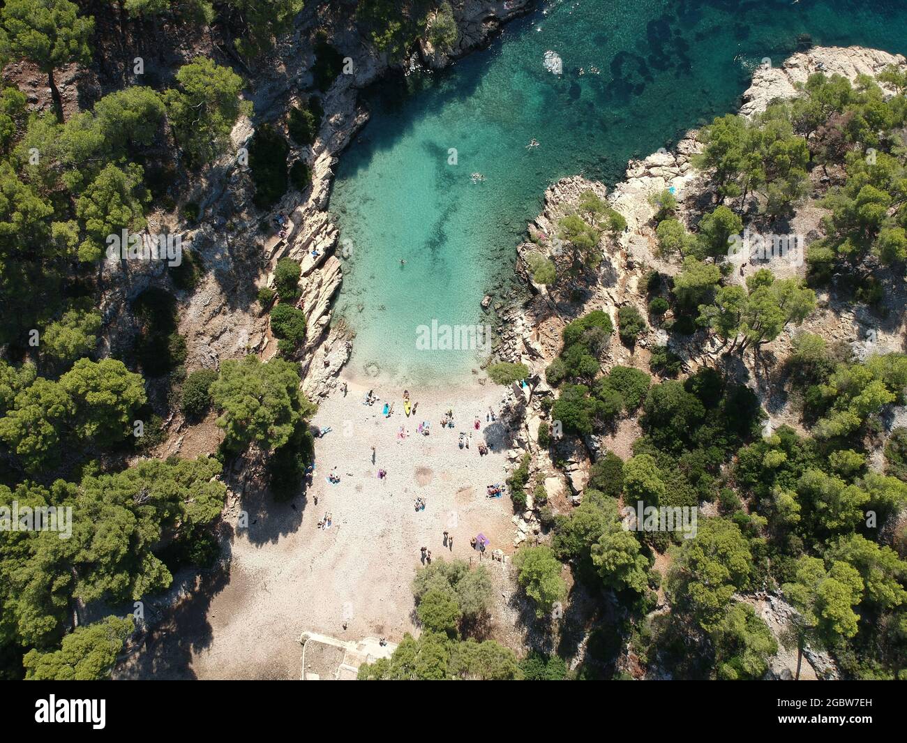 Aerial view of Calanque de Port Pin Beach with rocks and trees in ...