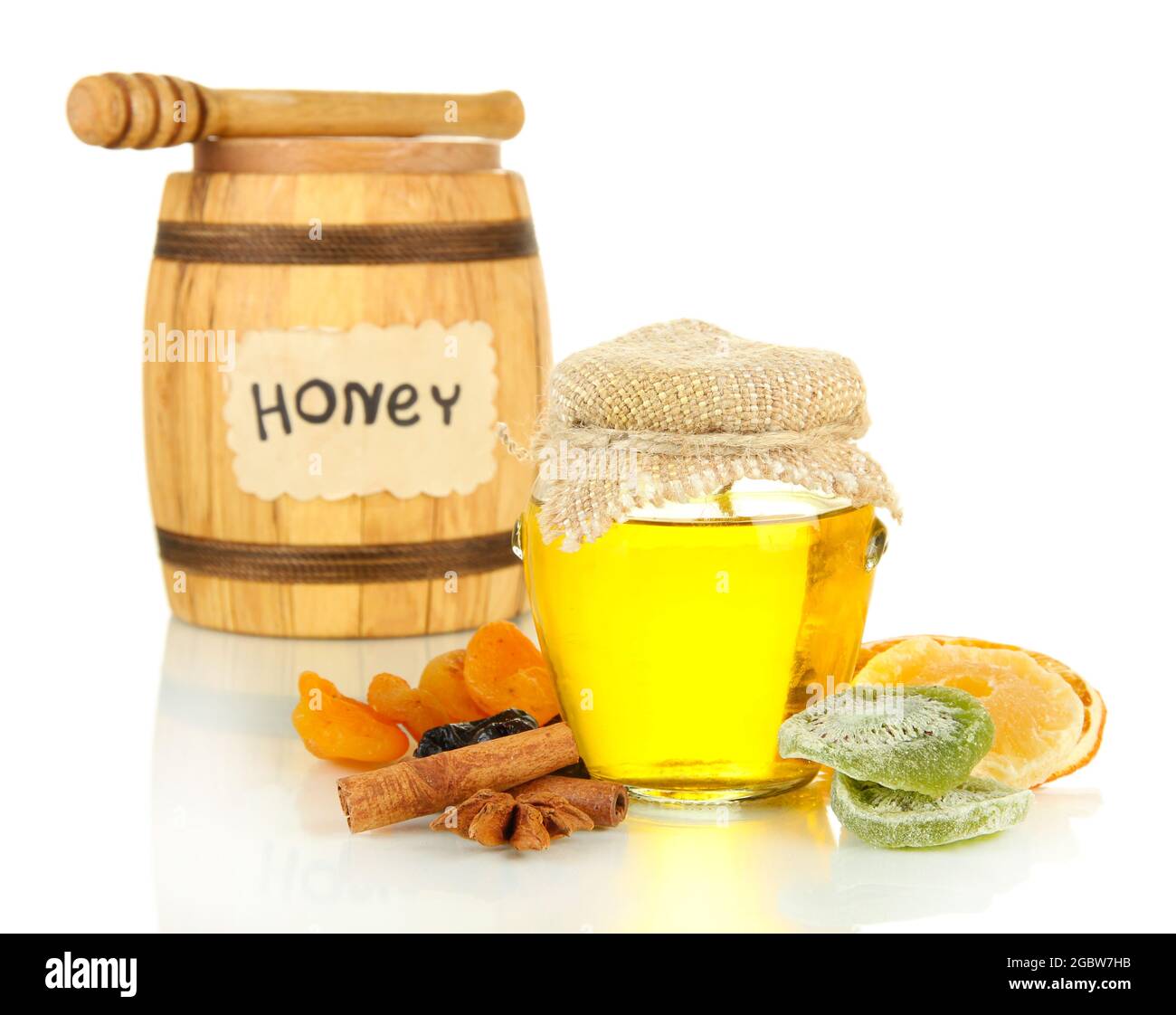 Jar of honey, wooden barrel, drizzler and dried fruits isolated on ...