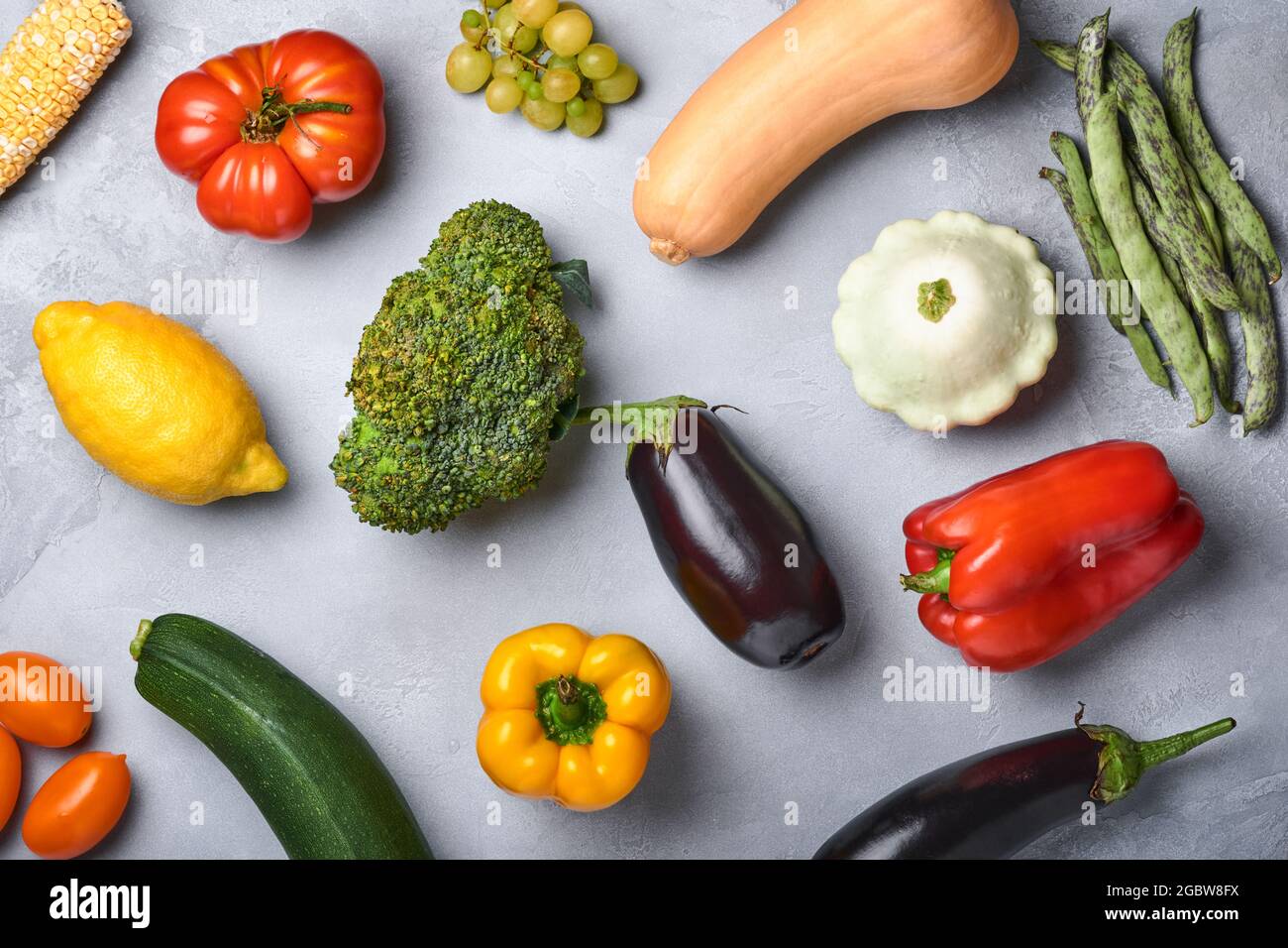 Assortment of fresh fruits and organic multicolored rainbow vegetables ...