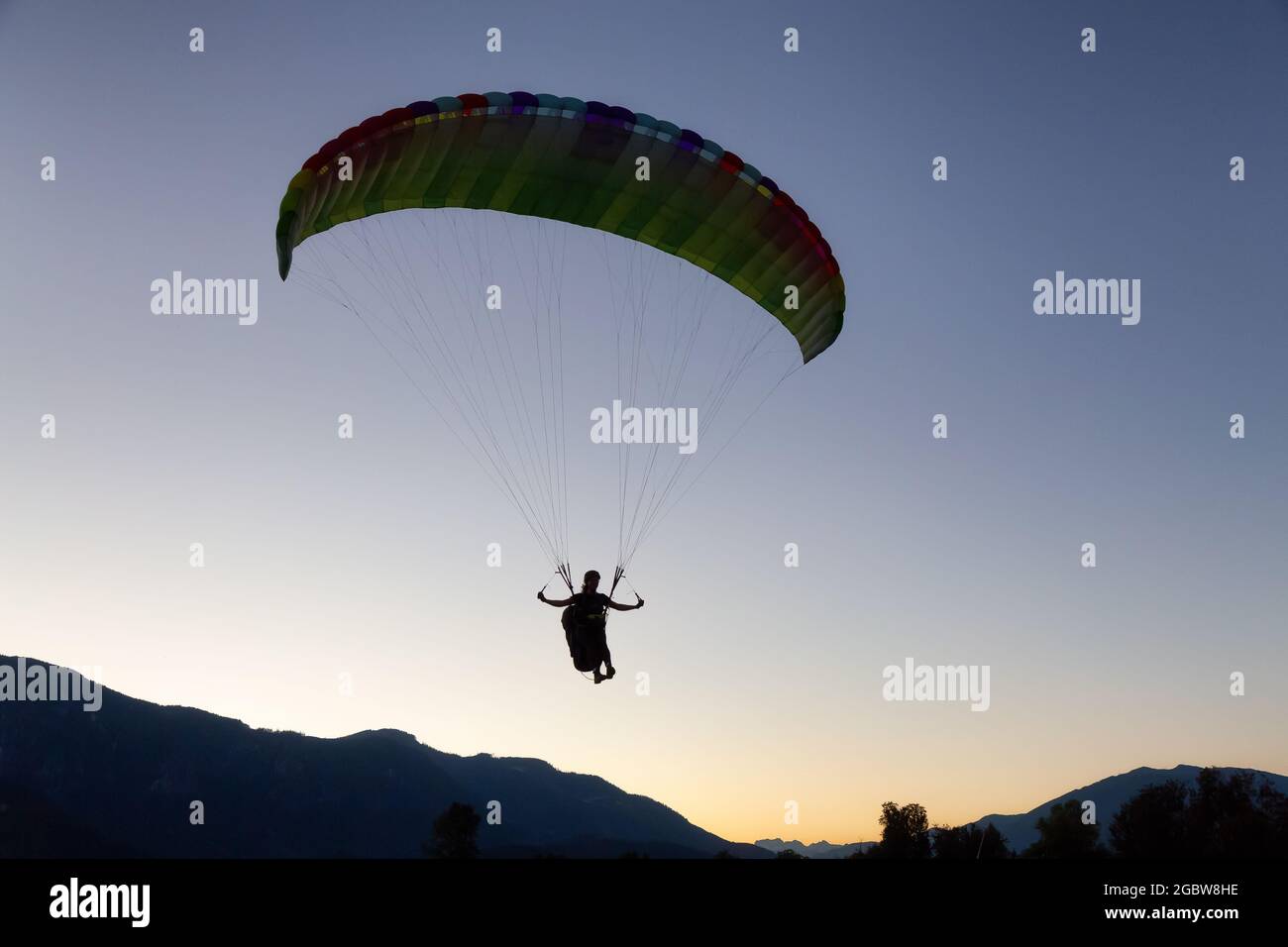 Woman landing parachute hi-res stock photography and images - Alamy