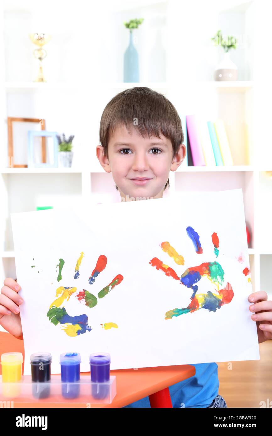 Cute little boy with his colorful handprint Stock Photo - Alamy