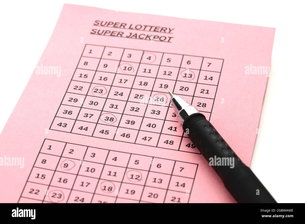 Lottery ticket and pen, isolated on white Stock Photo - Alamy