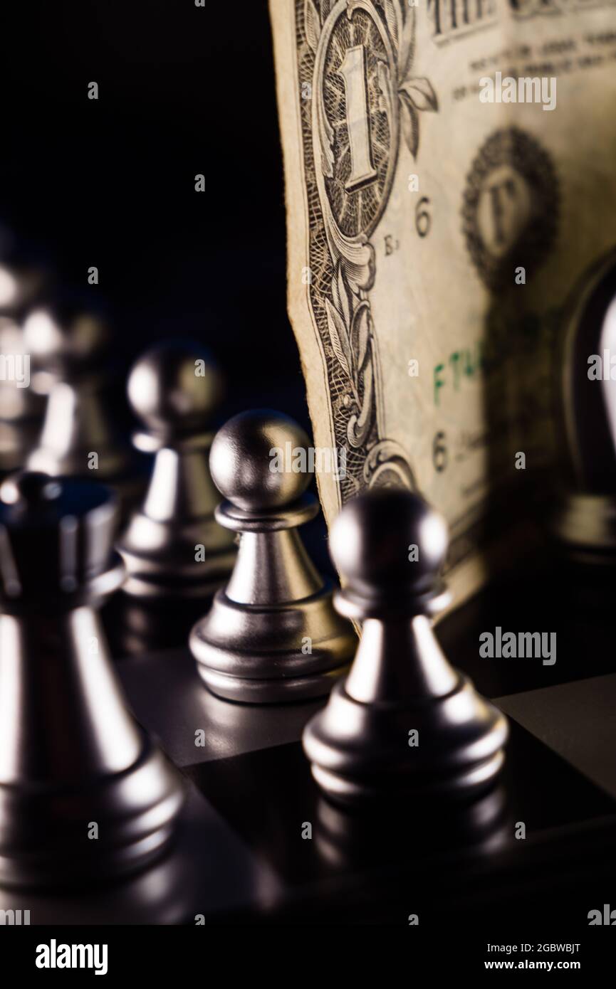 Vertical closeup shot of an arranged chessboard with metallic silver ...