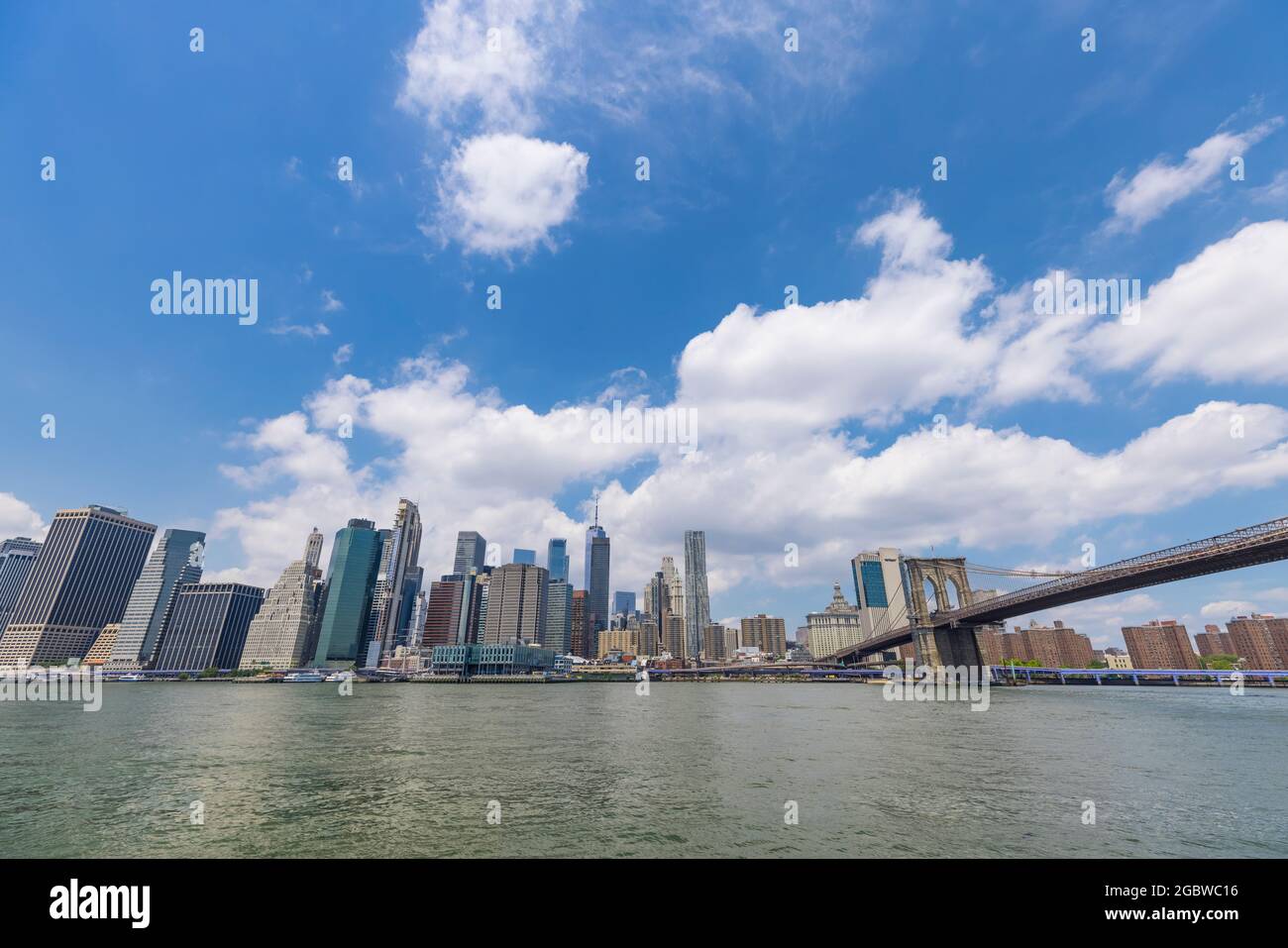 Unique shape summer clouds float over the Lower Manhattan skyscraper ...