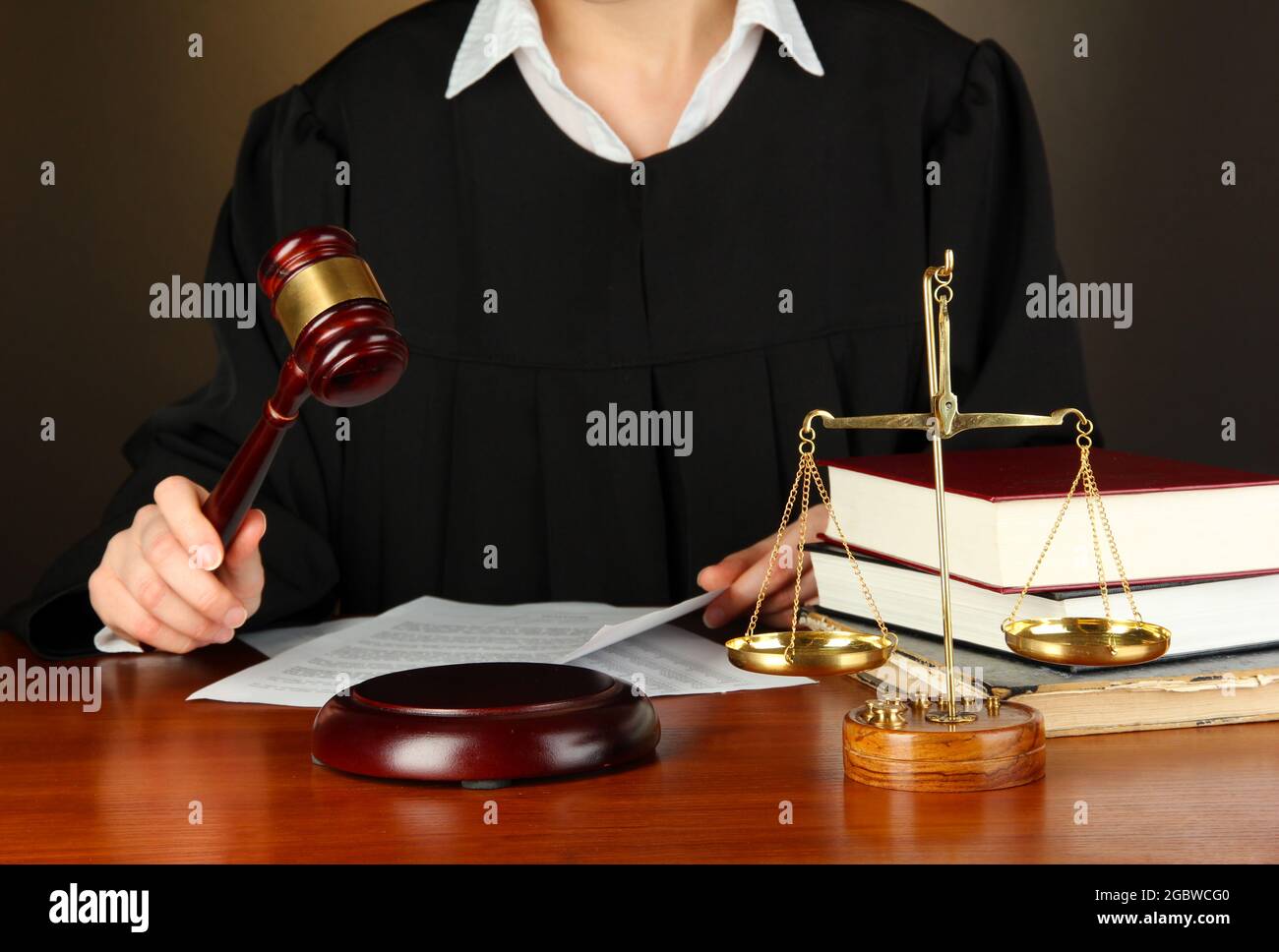 Judge sitting at table during court hearings on black background Stock ...