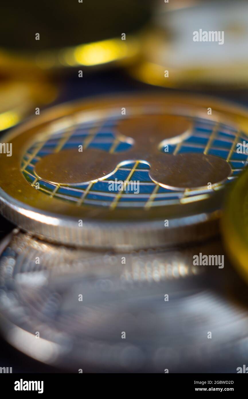Vertical shot of a gold coin Stock Photo - Alamy