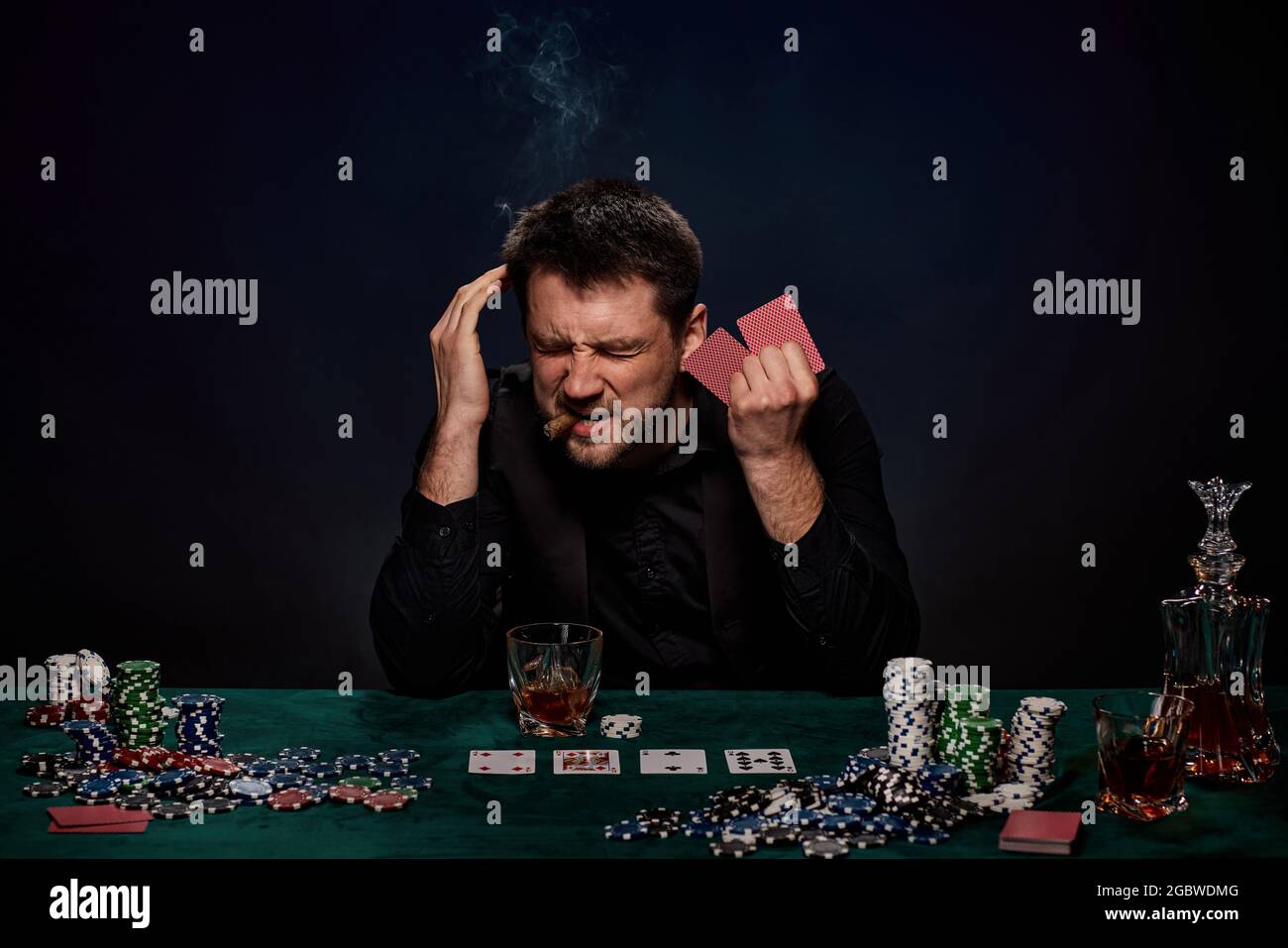 Young man playing poker hi-res stock photography and images - Alamy